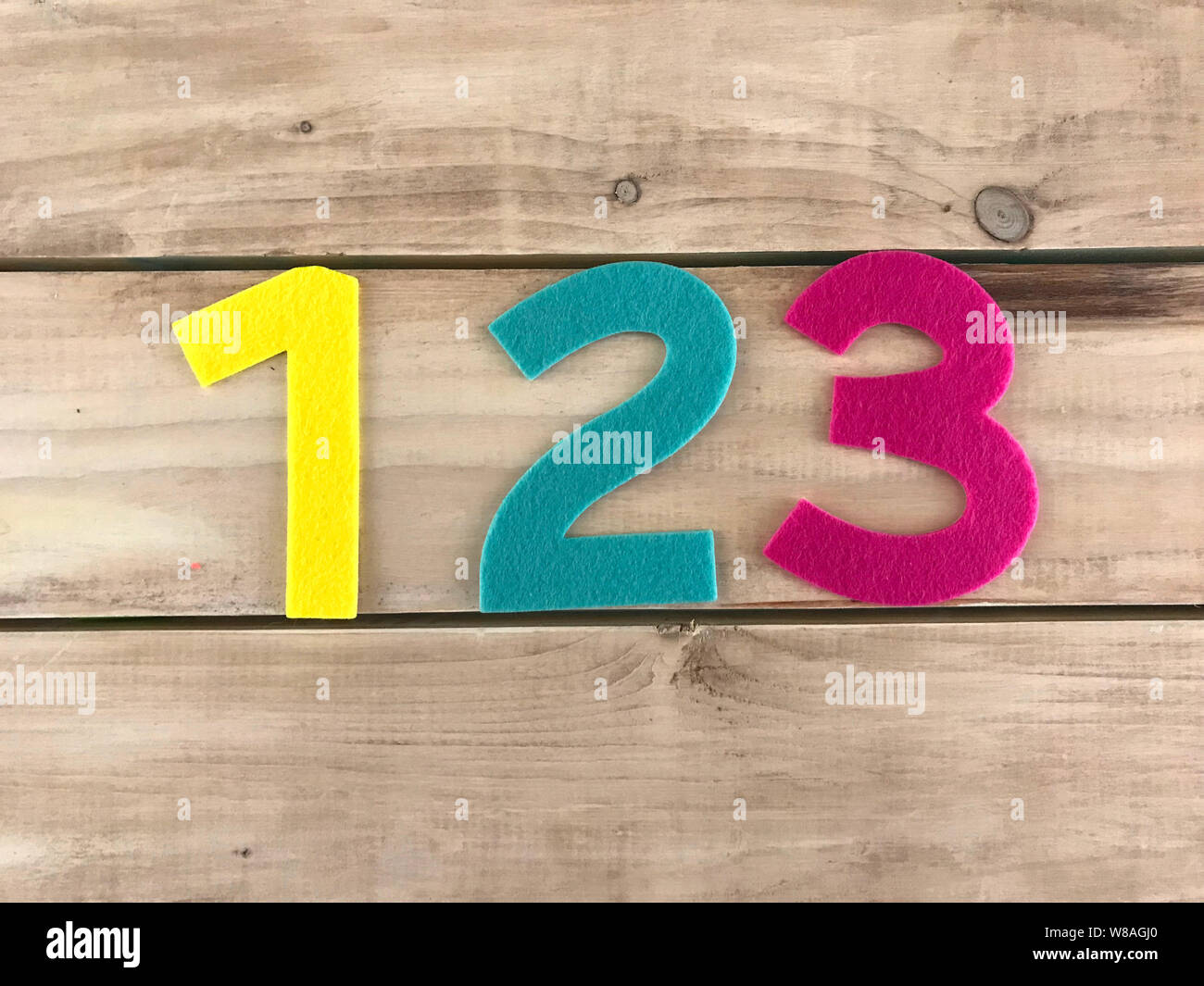 one two three numbers in wood backgrouond photo Stock Photo - Alamy