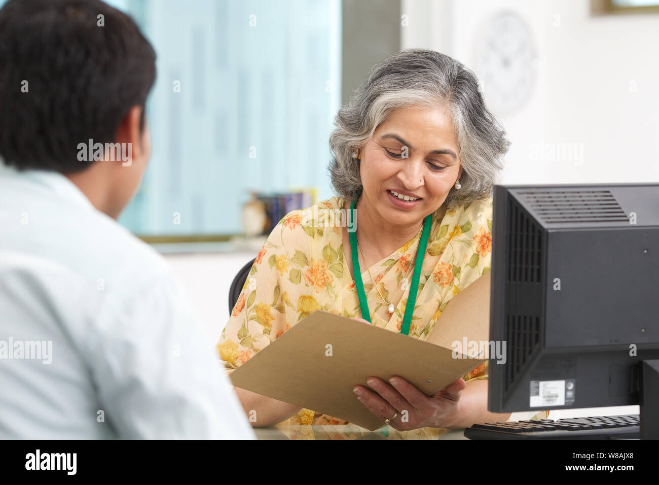 Bank customer service sitting hi-res stock photography and images - Alamy