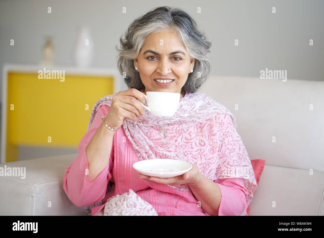 Indian woman drinking tea hi-res stock photography and images - Alamy