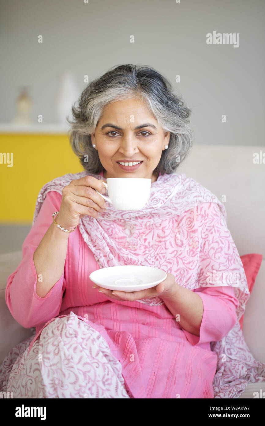 Indian woman drinking tea hi-res stock photography and images - Alamy