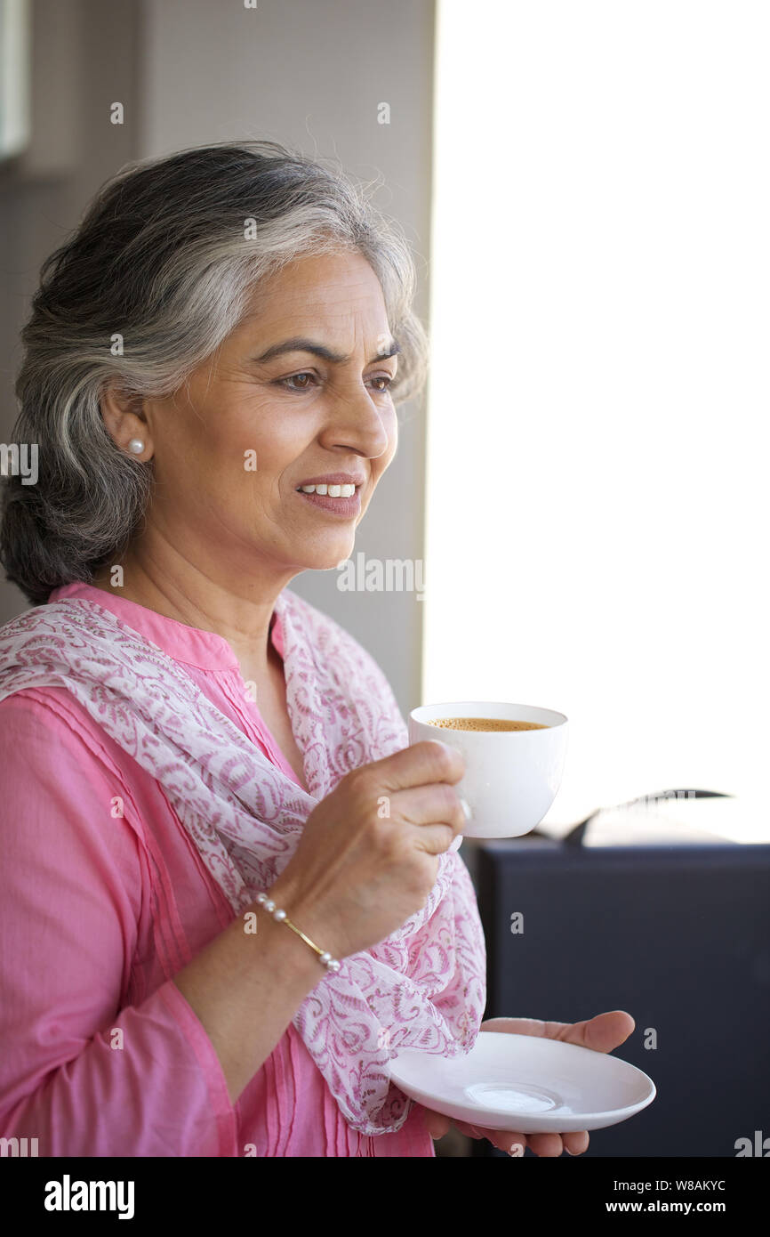 Indian woman drinking tea hi-res stock photography and images - Alamy