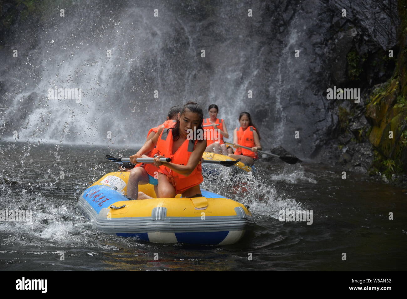 Female Chinese rafting lifeguard candidates row rafting boats in the ...