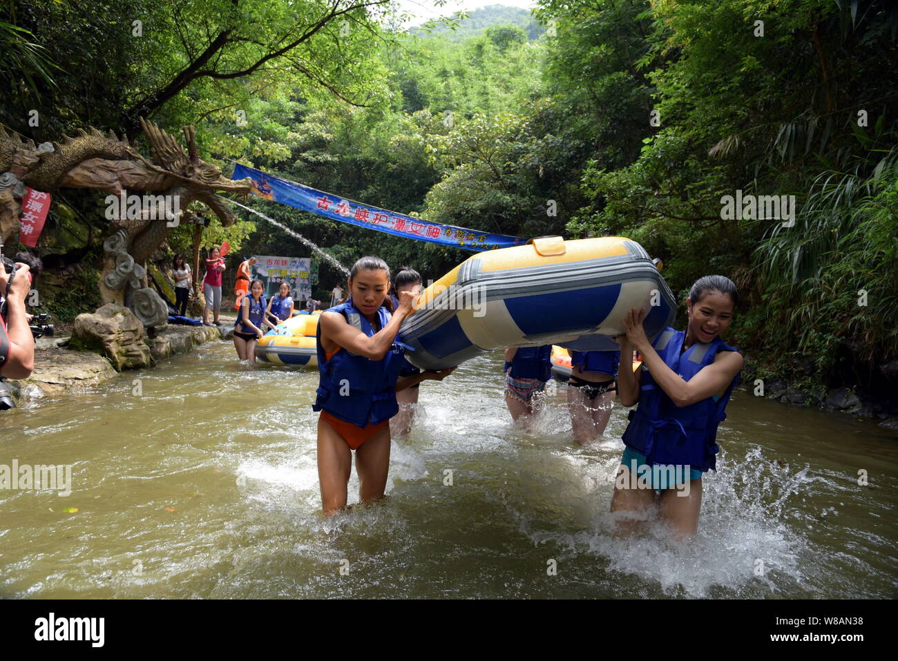 Female Chinese Rafting Lifeguard Candidates Carry Rafting Boats In The