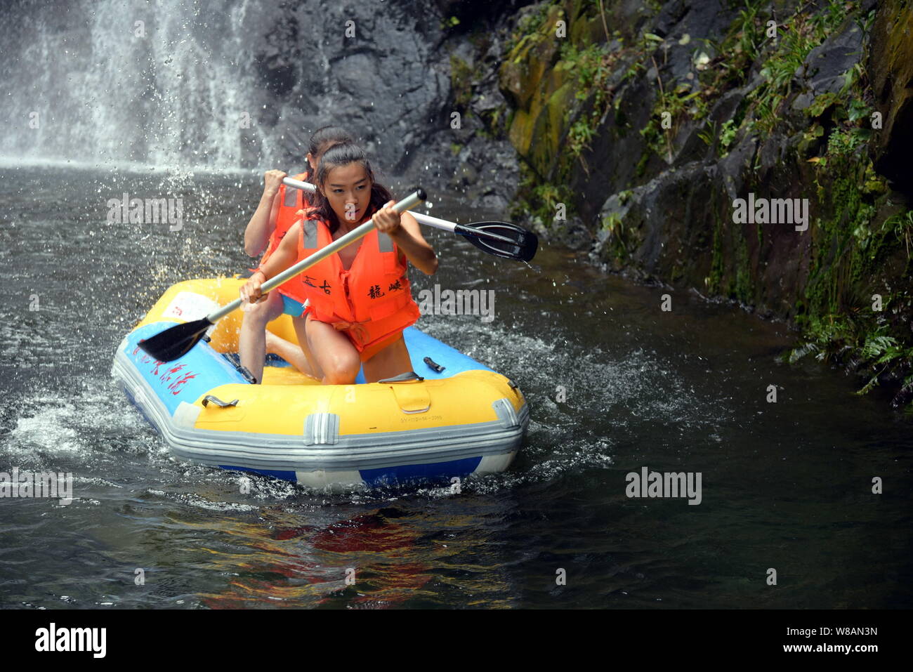 Female Chinese rafting lifeguard candidates row a rafting boat in the ...