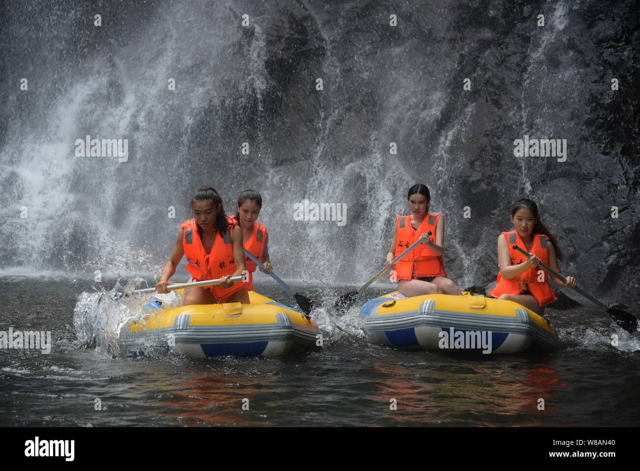Female Chinese rafting lifeguard candidates row rafting boats in the ...