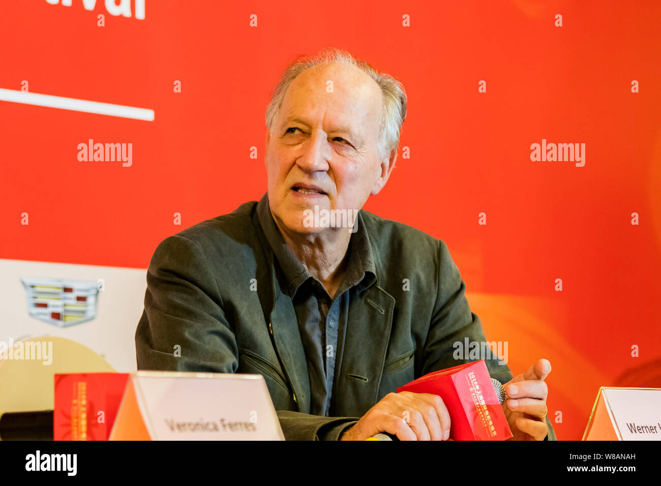 German film director Werner Herzog listens to a question at a press ...