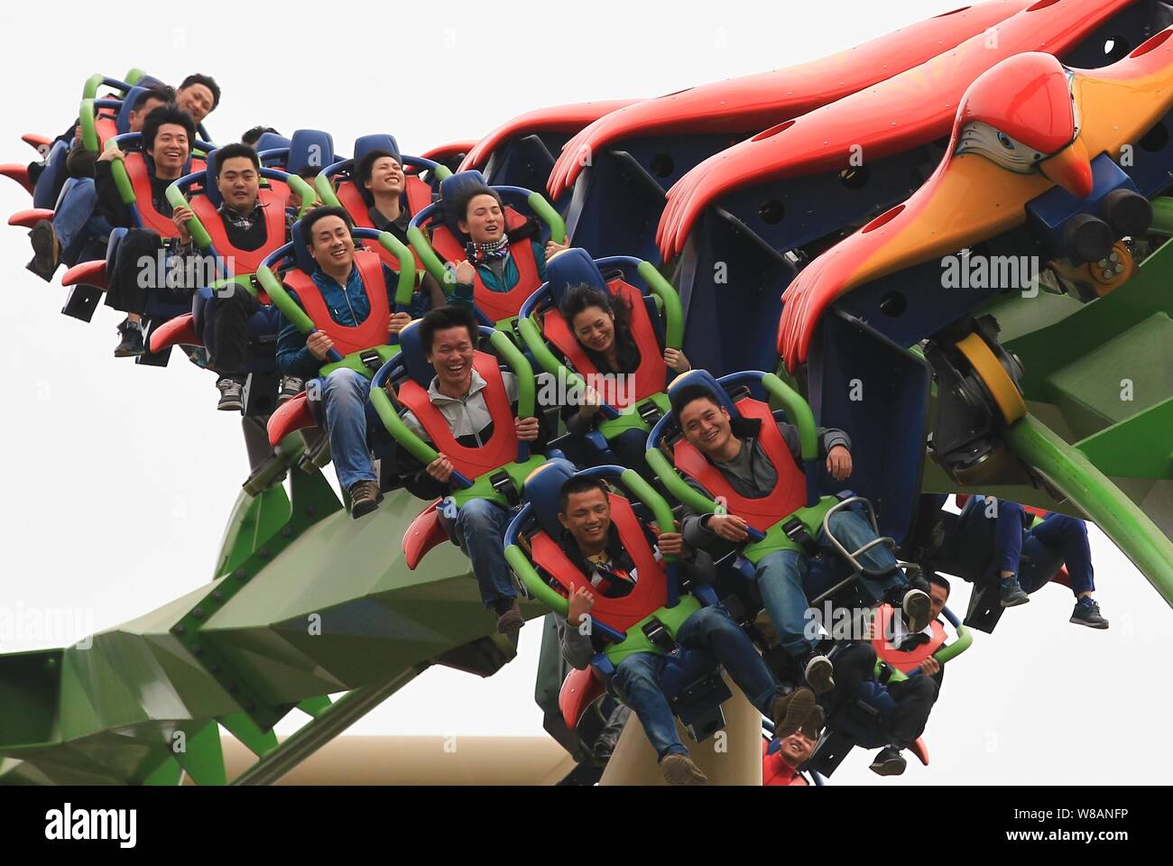 Tourists have fun on the roller coaster at Chimelong Ocean Kingdom, the ...
