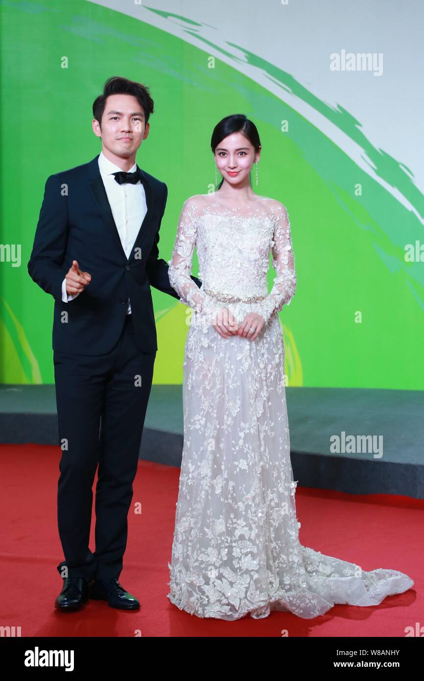 Hong Kong model and actress Angelababy, right, and actor Wallace Chung ...
