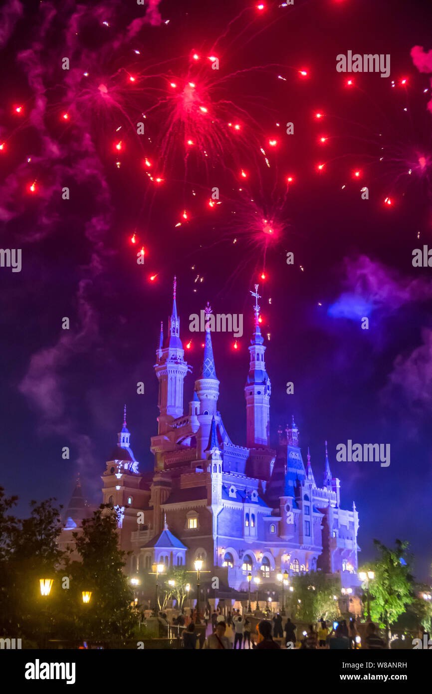 Fireworks explode over the Disney Castle in the Shanghai Disneyland ...