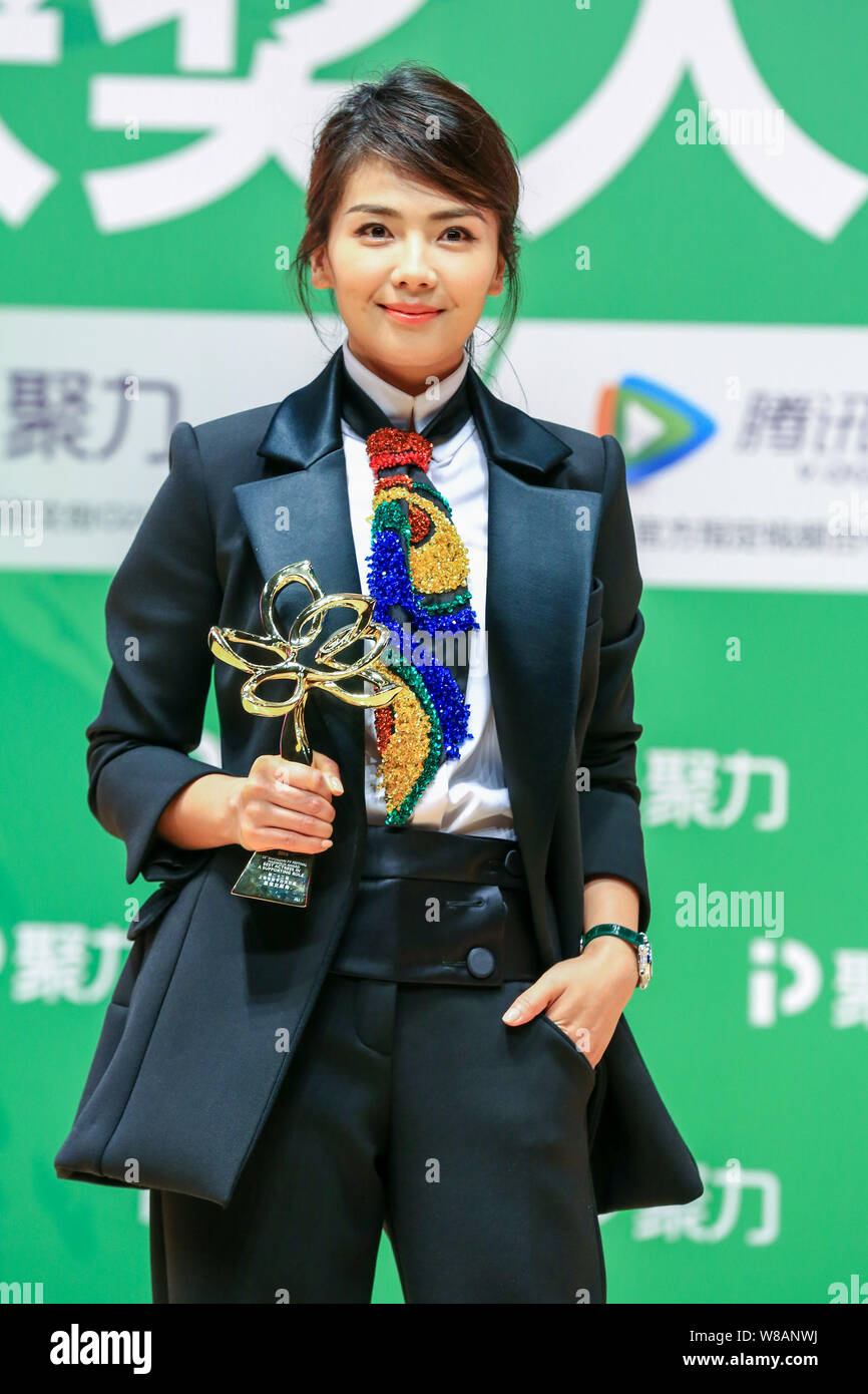 Chinese actress Liu Tao poses with her trophy for the Best Supporting ...
