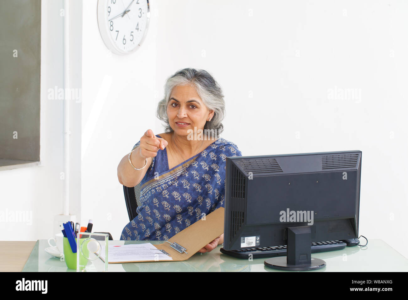 Sitting pointing communication authority hi-res stock photography and ...