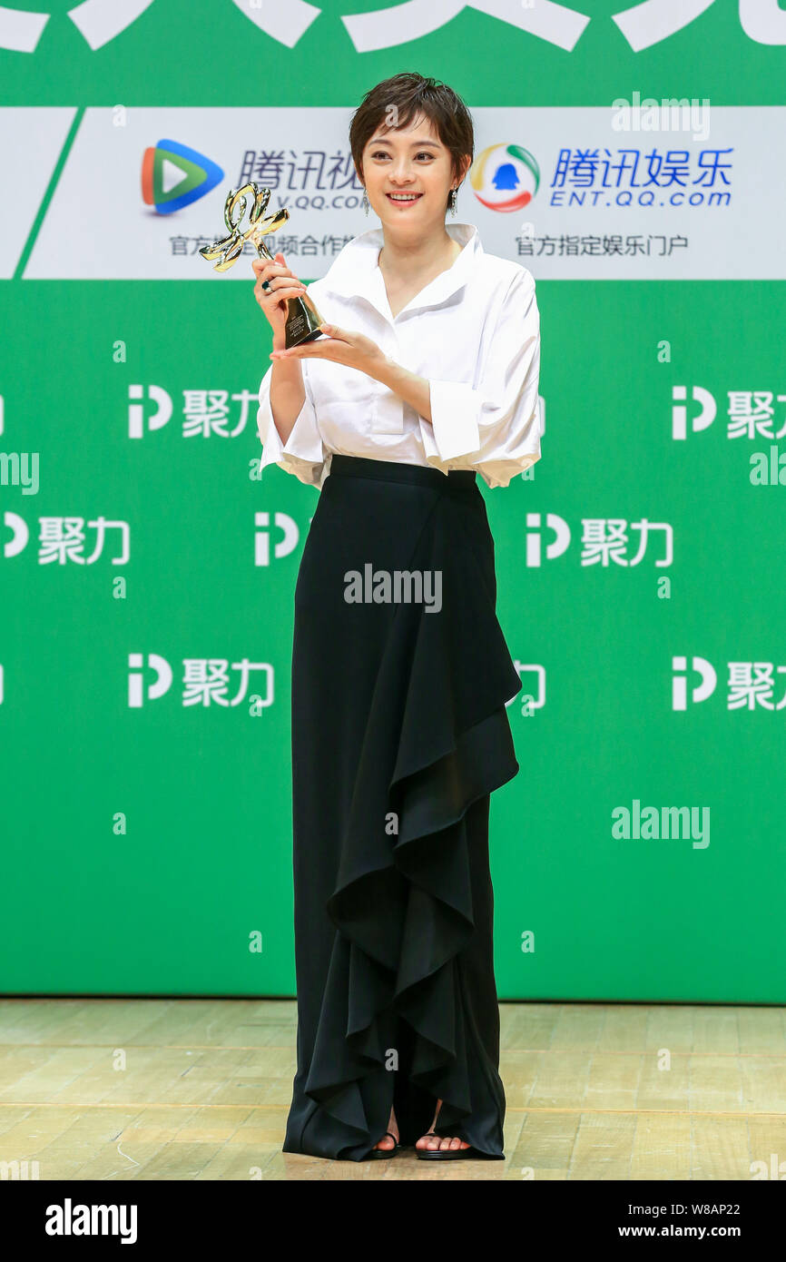 Chinese actress Sun Li poses with her trophy for the Best Actress award ...