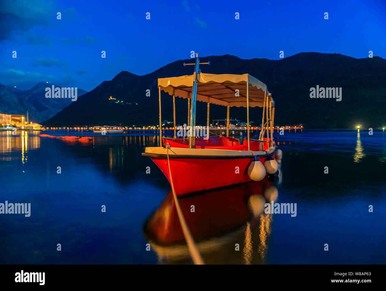 Long exposure sunset view of Kotor Bay and a docked boat in the ...