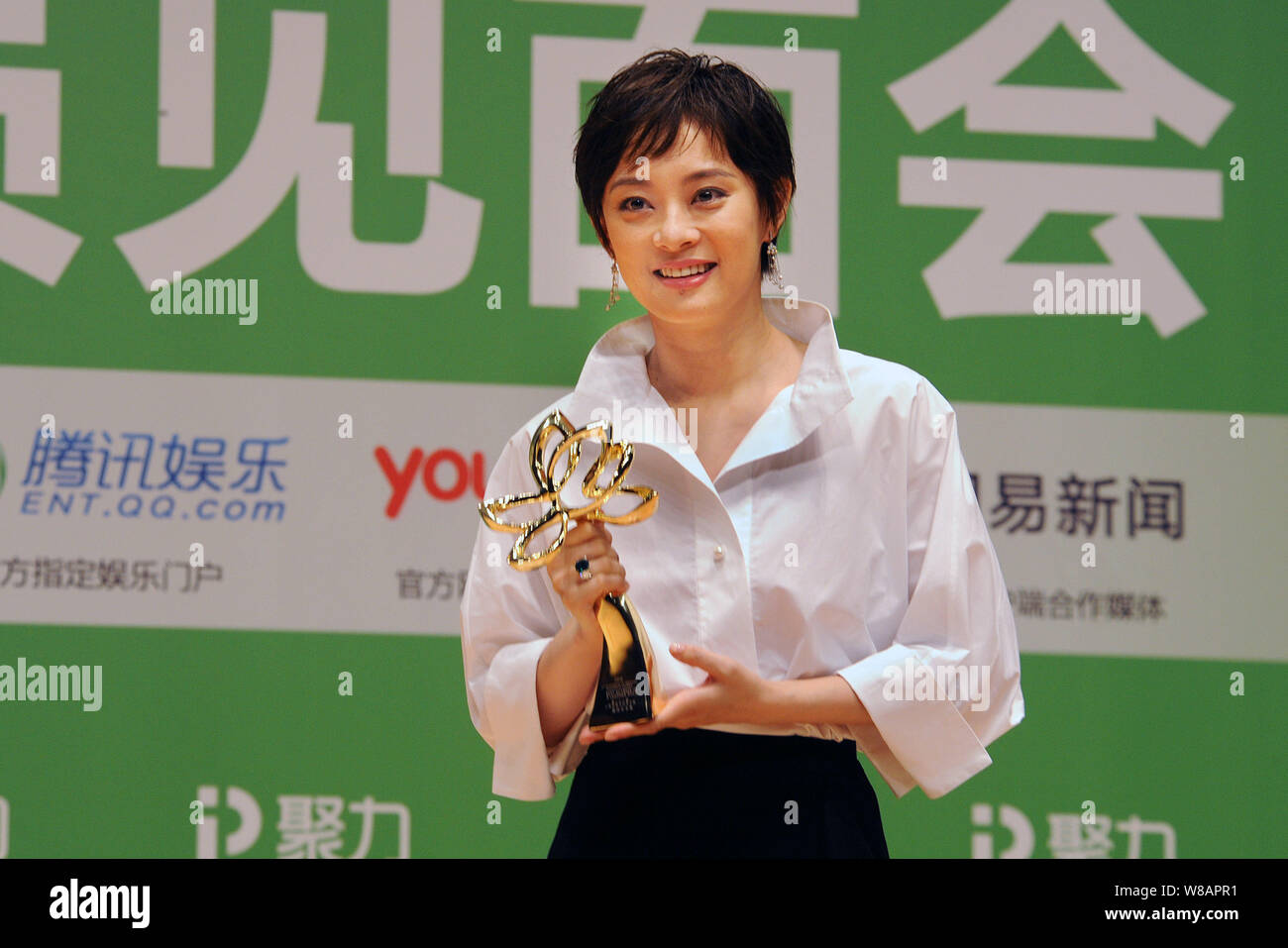 Chinese actress Sun Li poses with her trophy for the Best Actress award ...