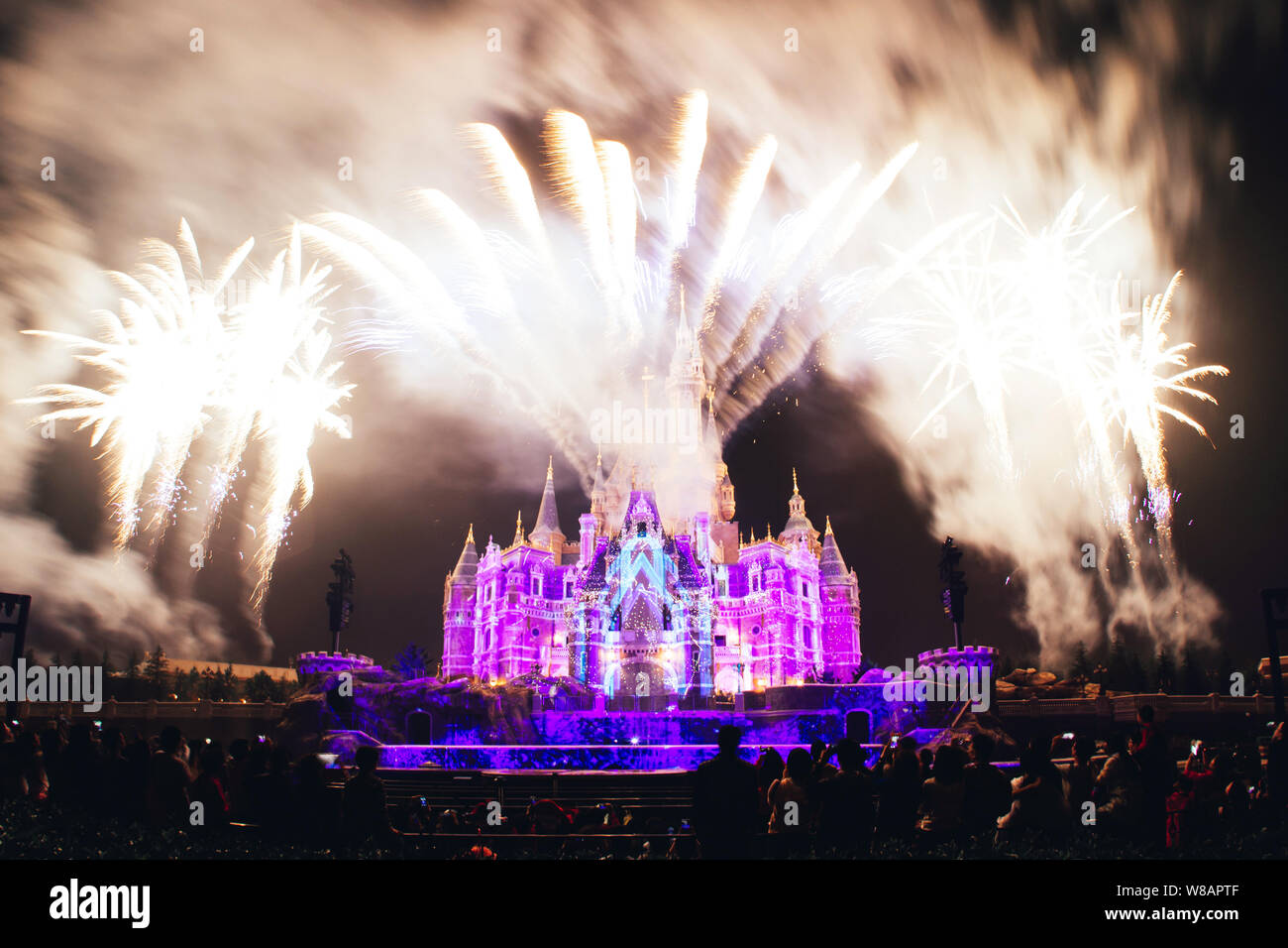 Fireworks explode over the Shanghai Disneyland at the Shanghai Disney ...