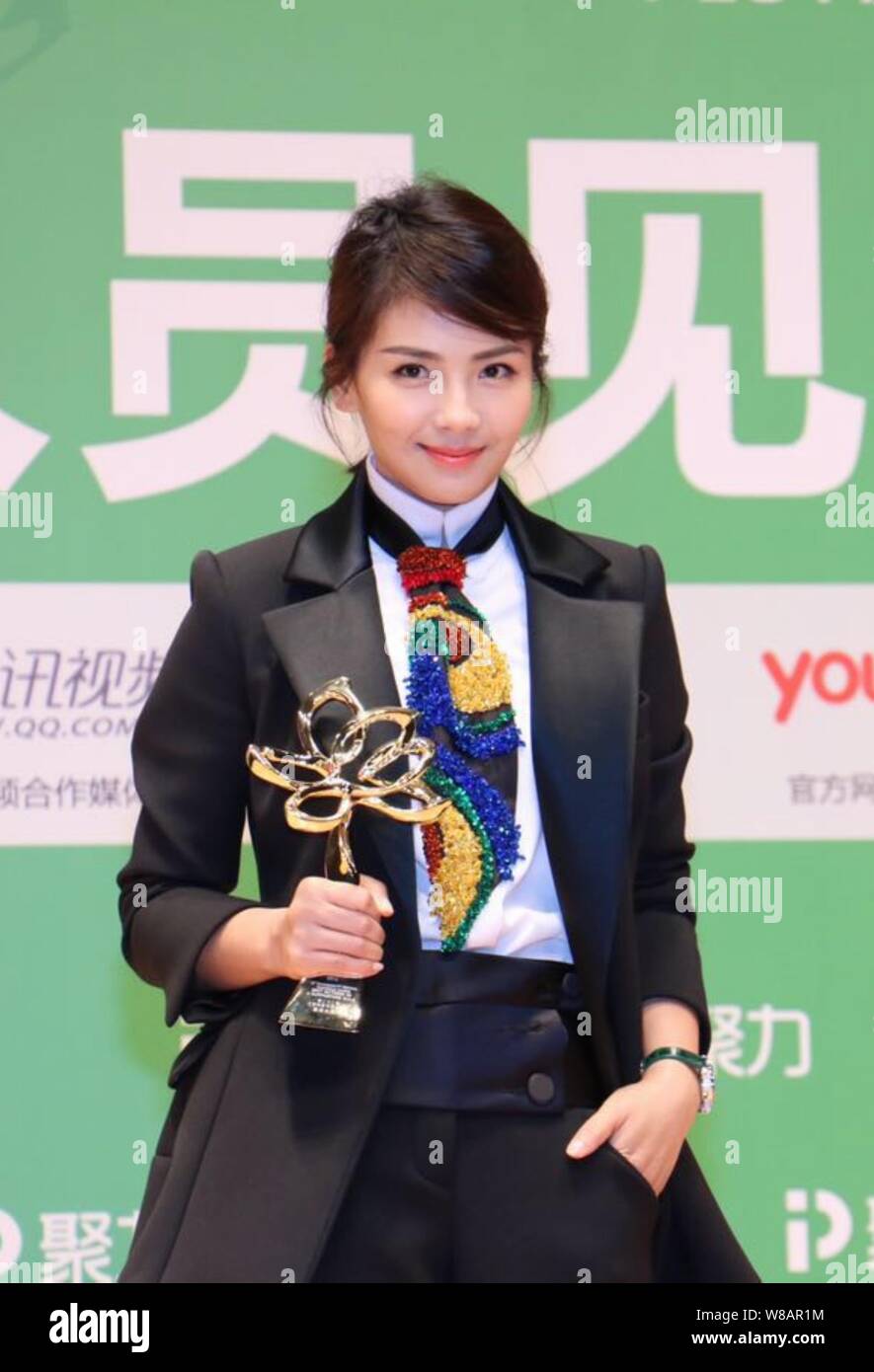 Chinese actress Liu Tao poses with her trophy for the Best Supporting ...