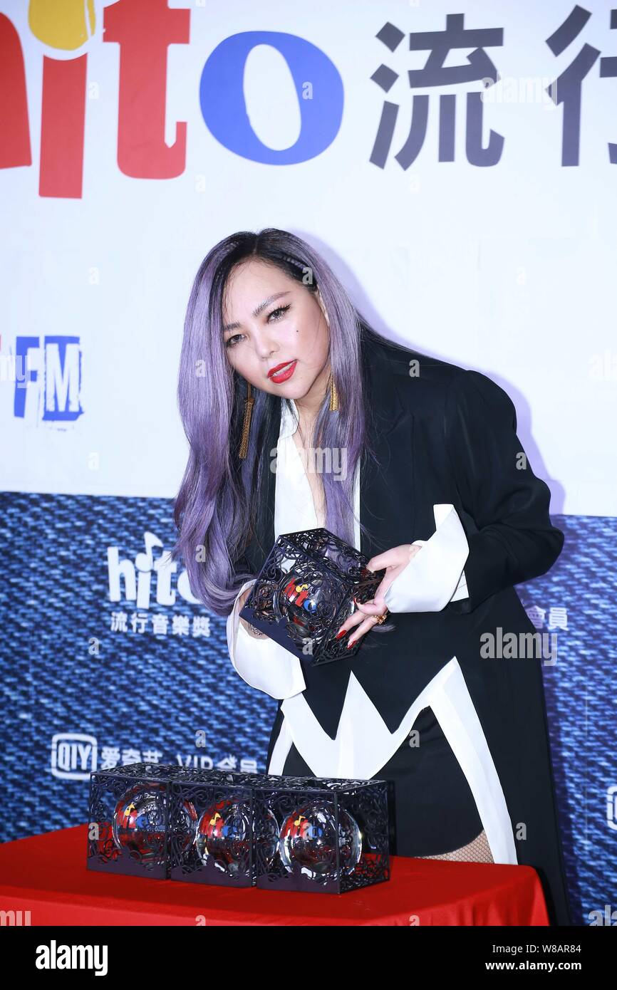 Taiwanese singer A-Mei or Chang Hui-mei poses with her trophies at the ...