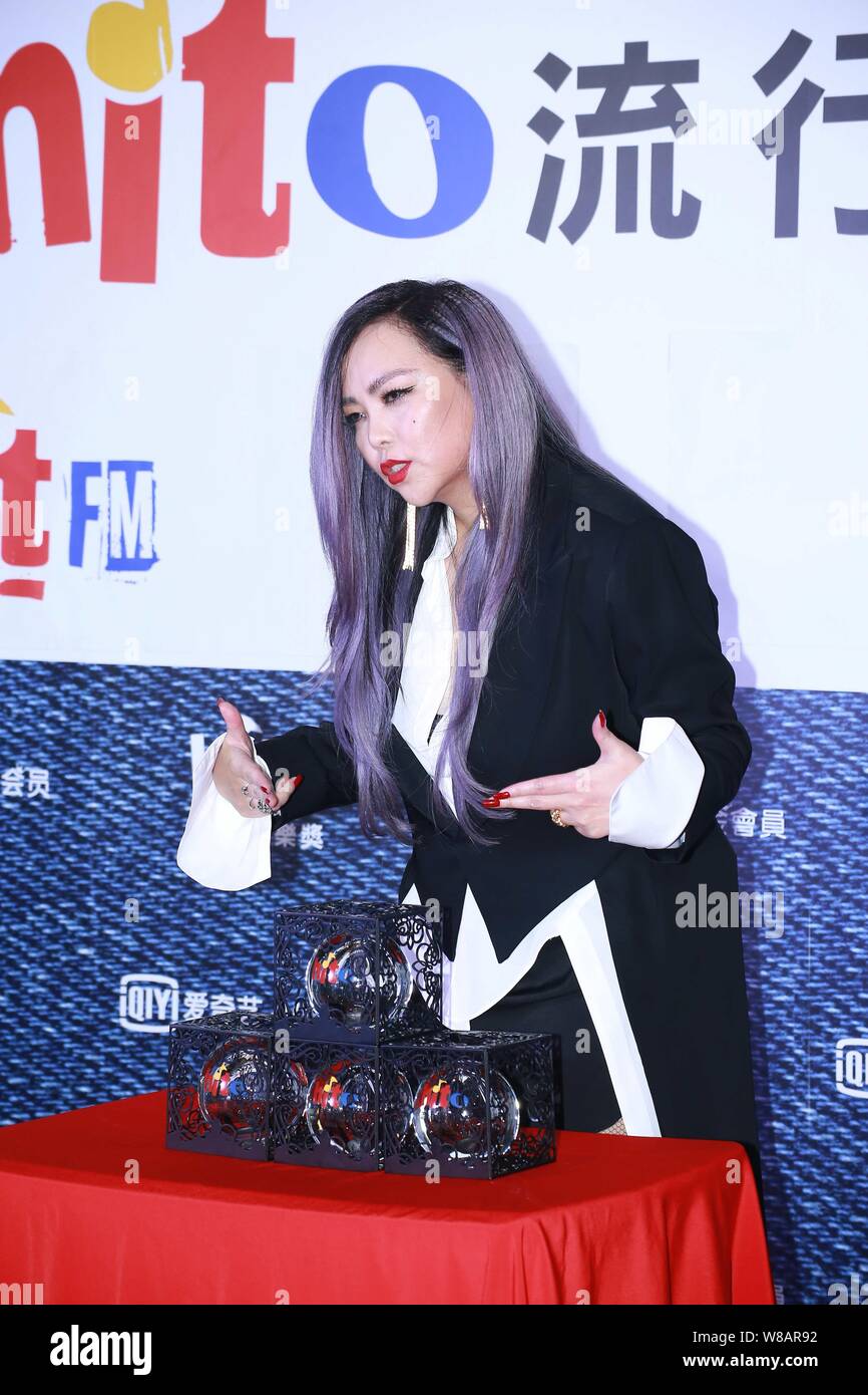 Taiwanese singer A-Mei or Chang Hui-mei poses with her trophies at the ...