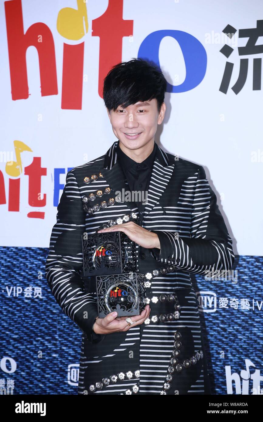 Singaporean singer JJ Lin poses with his trophies at the presentation ...