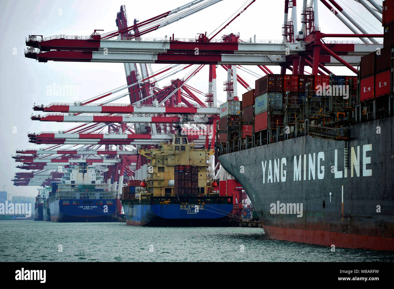 Container ships are docked on quays at the Port of Qingdao in Qingdao ...