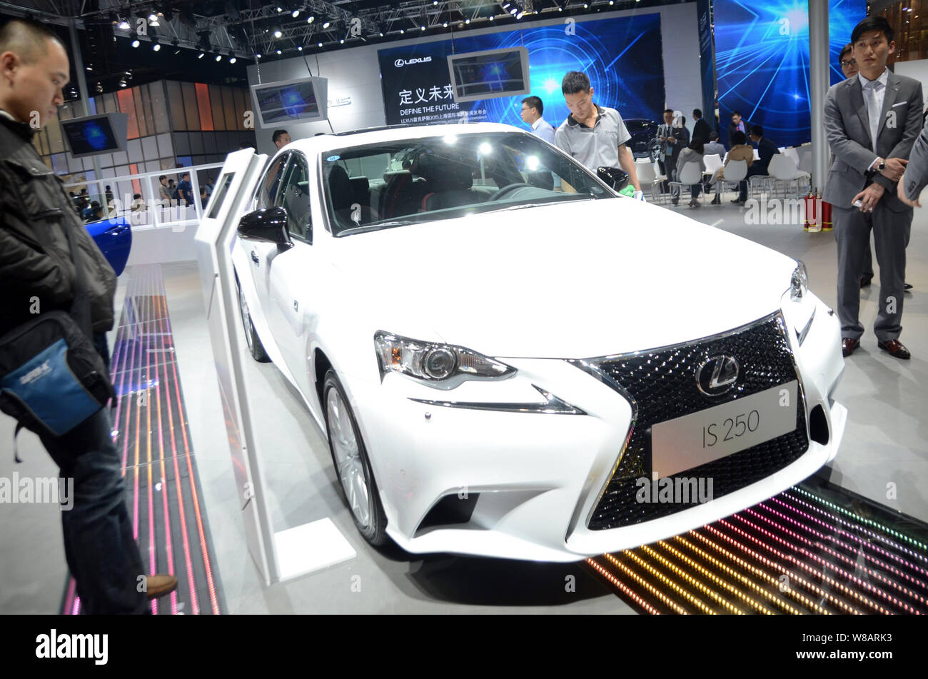 --FILE--Visitors look at a Lexus IS 250 on display during the 16th ...