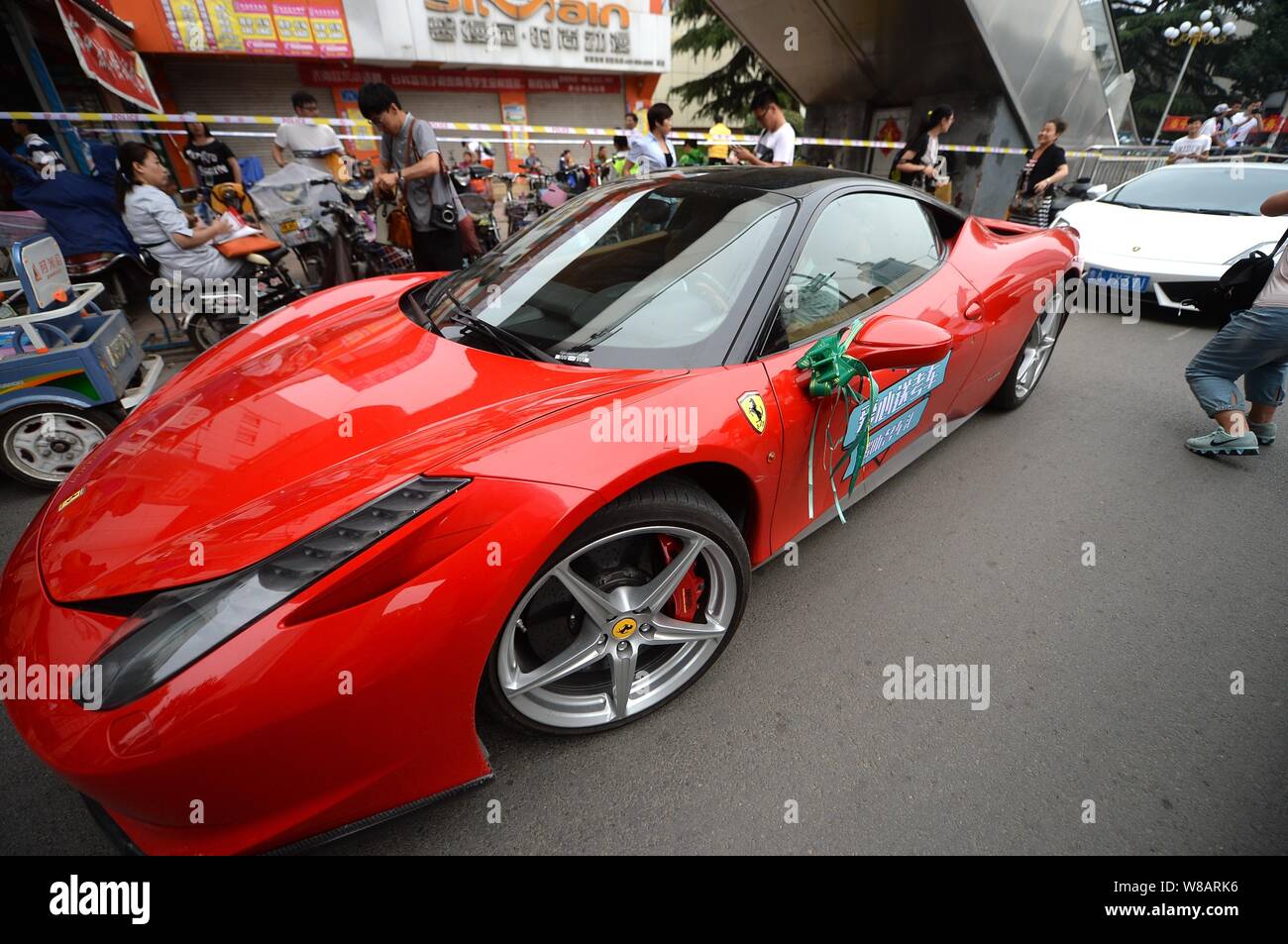 Ferrari 458 Italia and Lamborghini Gallardo sports cars arrive at the ...