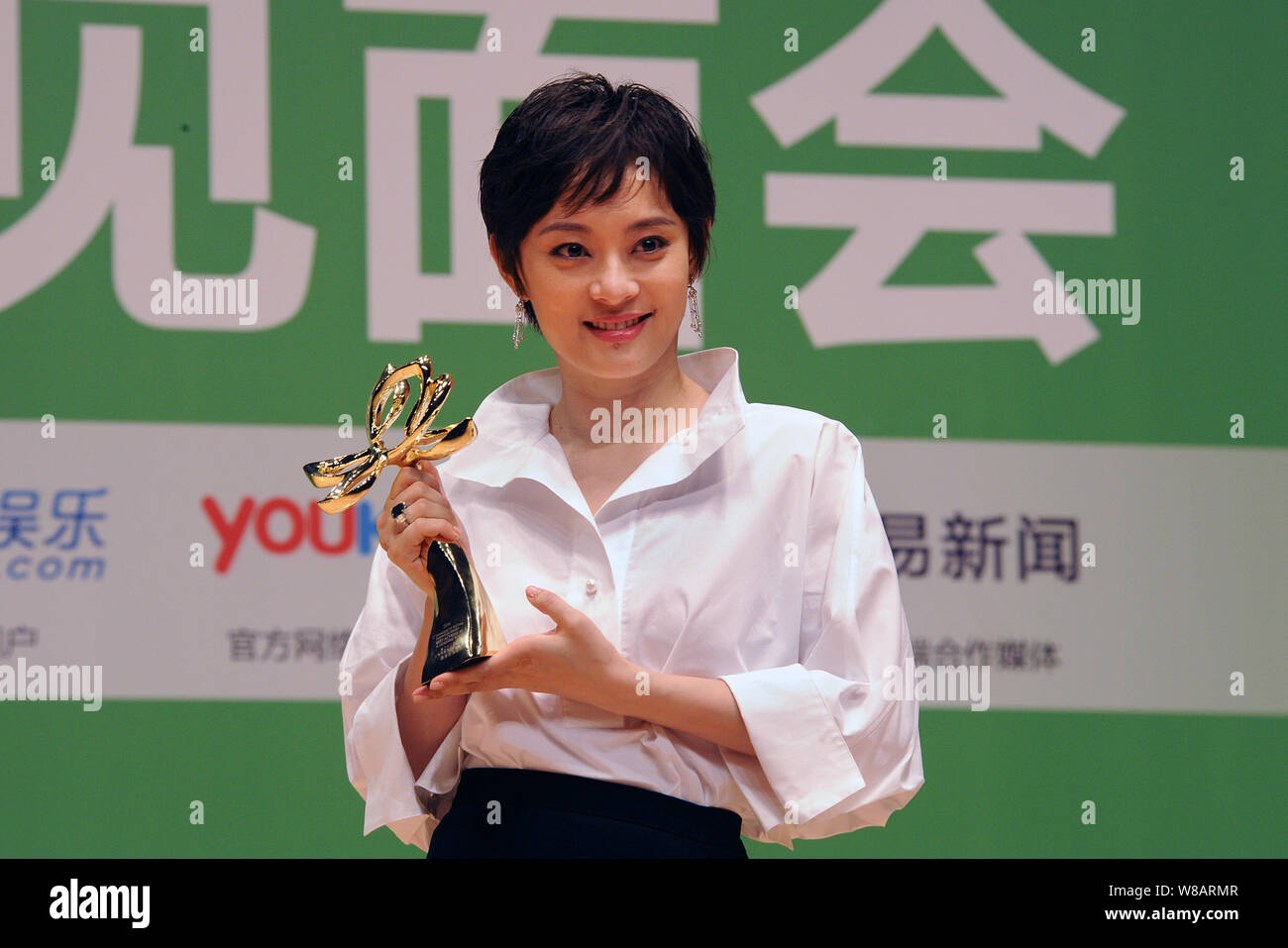 Chinese actress Sun Li poses with her trophy for the Best Actress award ...