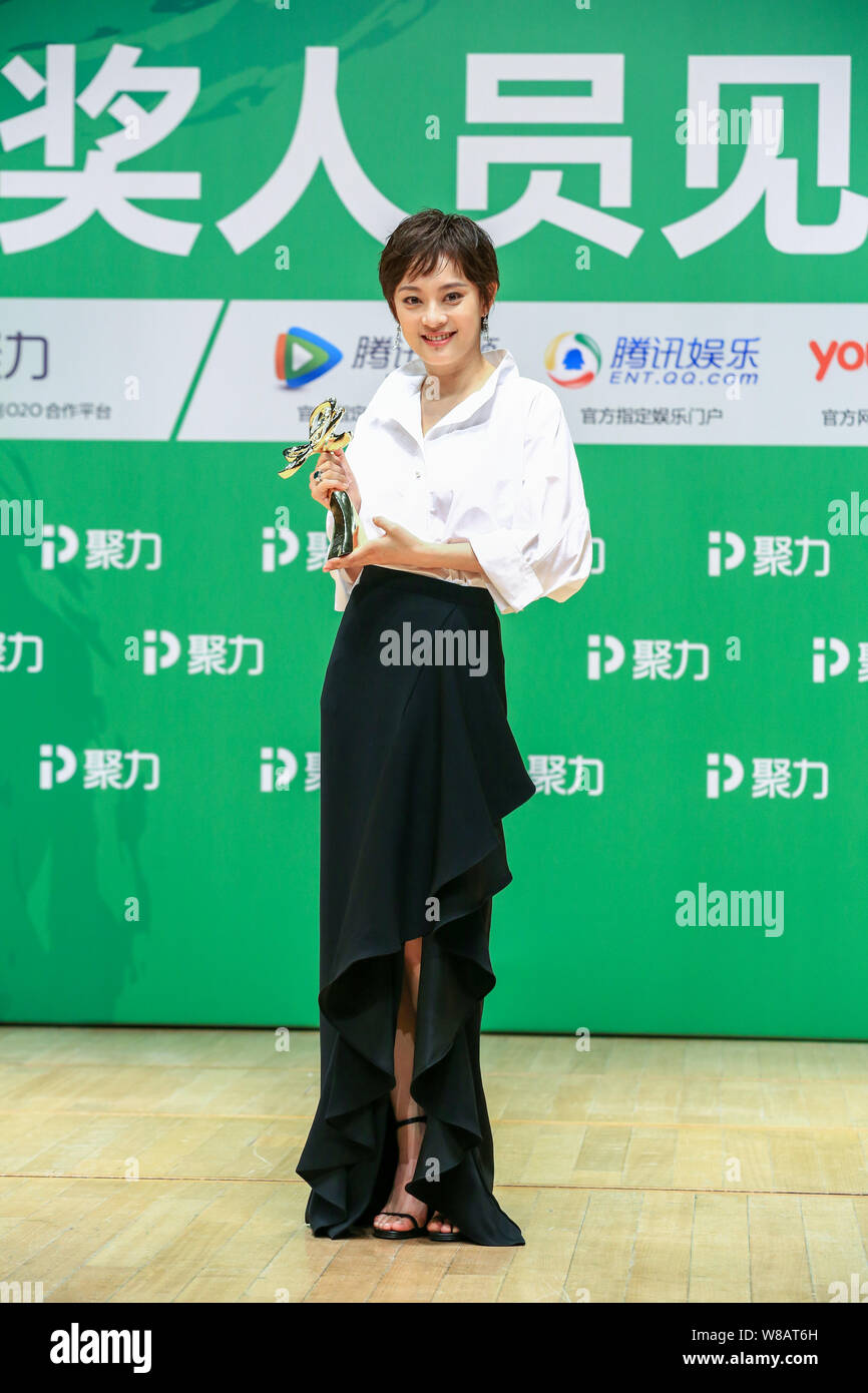 Chinese actress Sun Li poses with her trophy for the Best Actress award ...