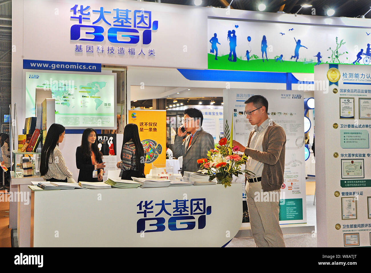--FILE--People visit the stand of BGI during an exhibition in Shanghai ...