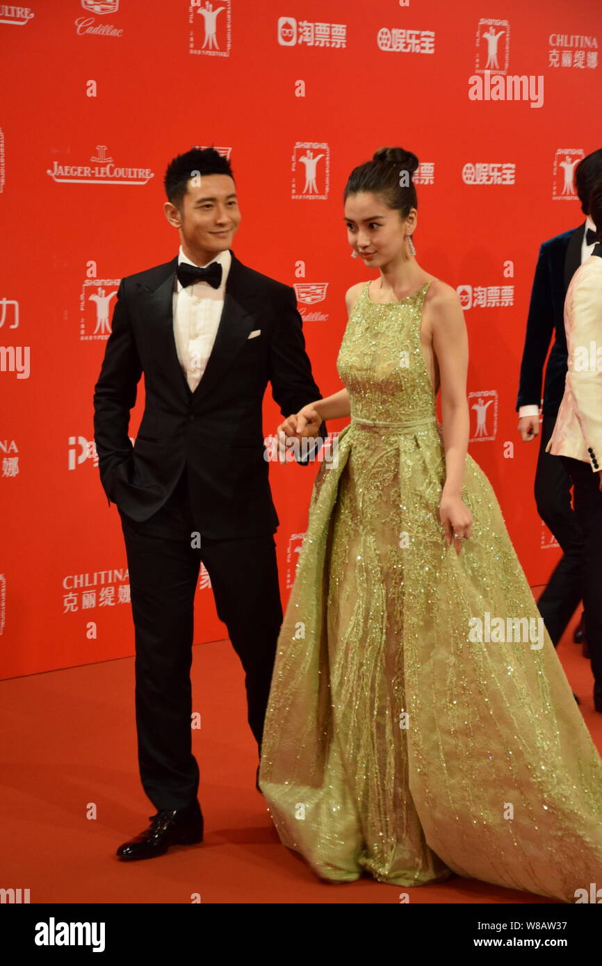 Hong Kong model and actress Angelababy, right, and her Chinese actor husband Huang Xiaoming ...