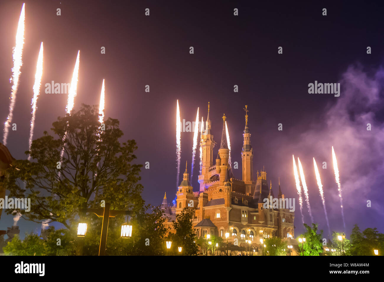 Fireworks explode over the Disney Castle in the Shanghai Disneyland ...
