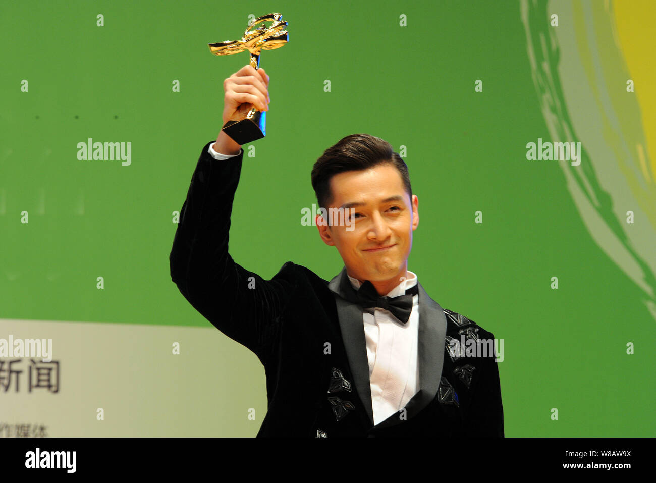 Chinese actor Hu Ge poses with his trophy for the Best Actor award for ...