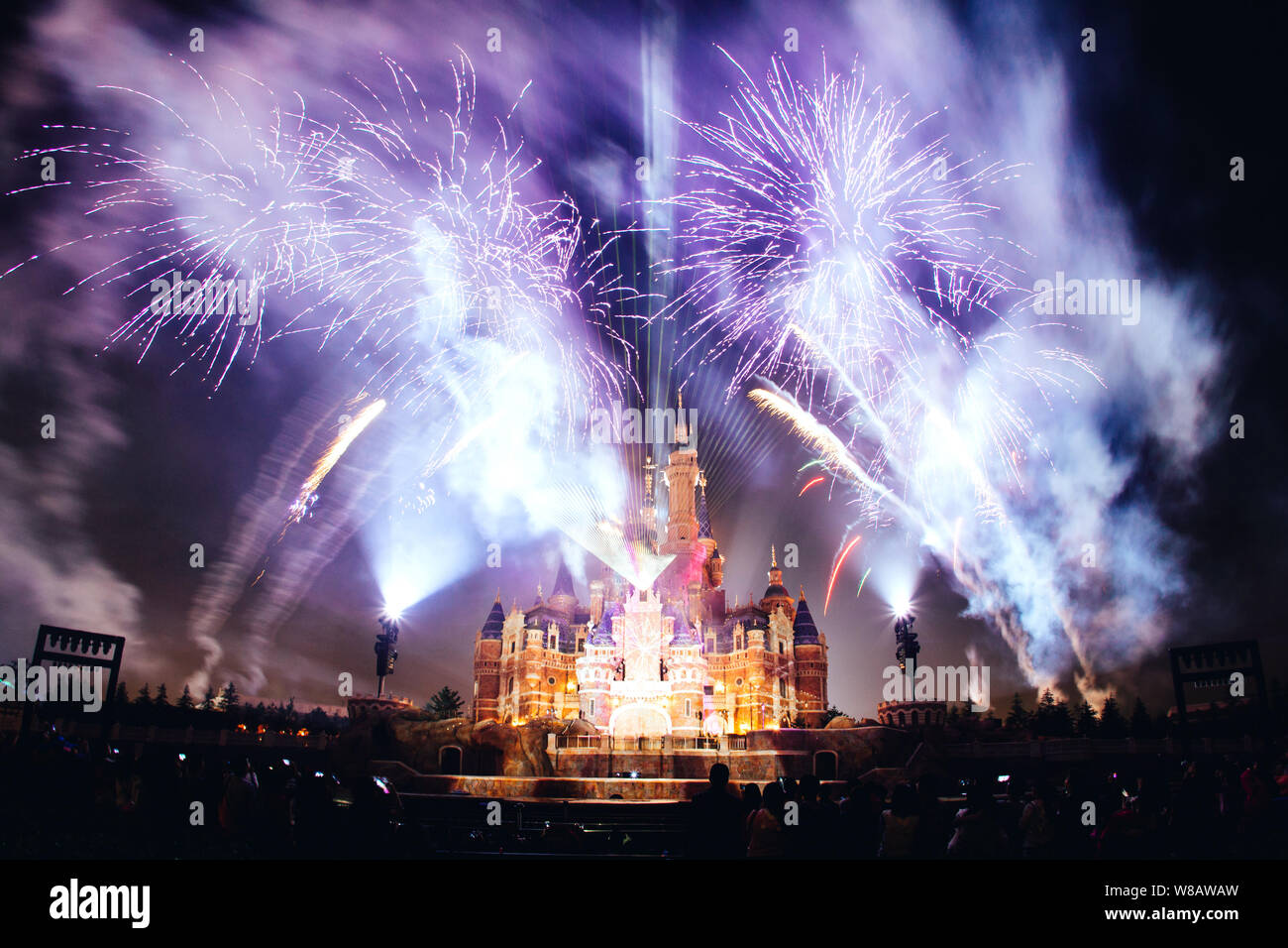 Fireworks explode over the Shanghai Disneyland at the Shanghai Disney ...