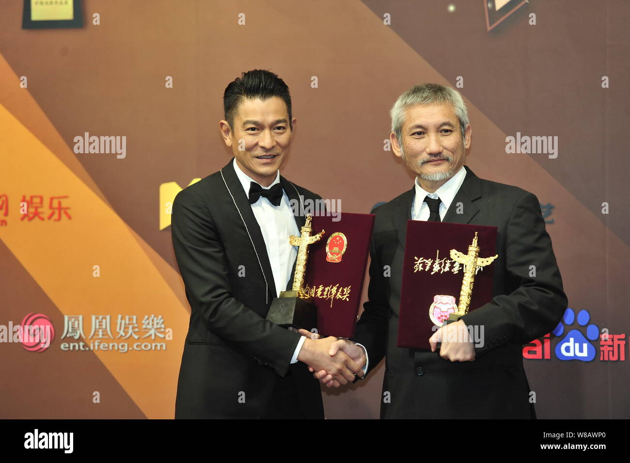 Hong Kong singer and actor Andy Lau, left, and director Tsui Hark pose ...