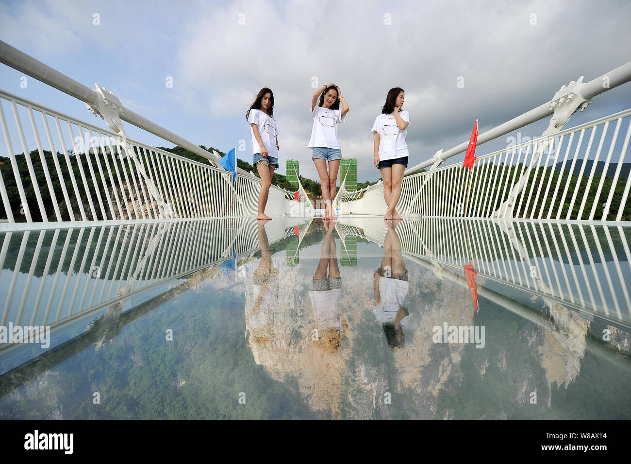 Chinese beauties walk on the world's longest and highest glass-bottomed ...