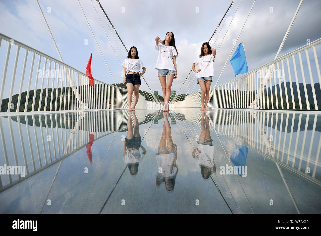 Chinese beauties walk on the world's longest and highest glass-bottomed ...
