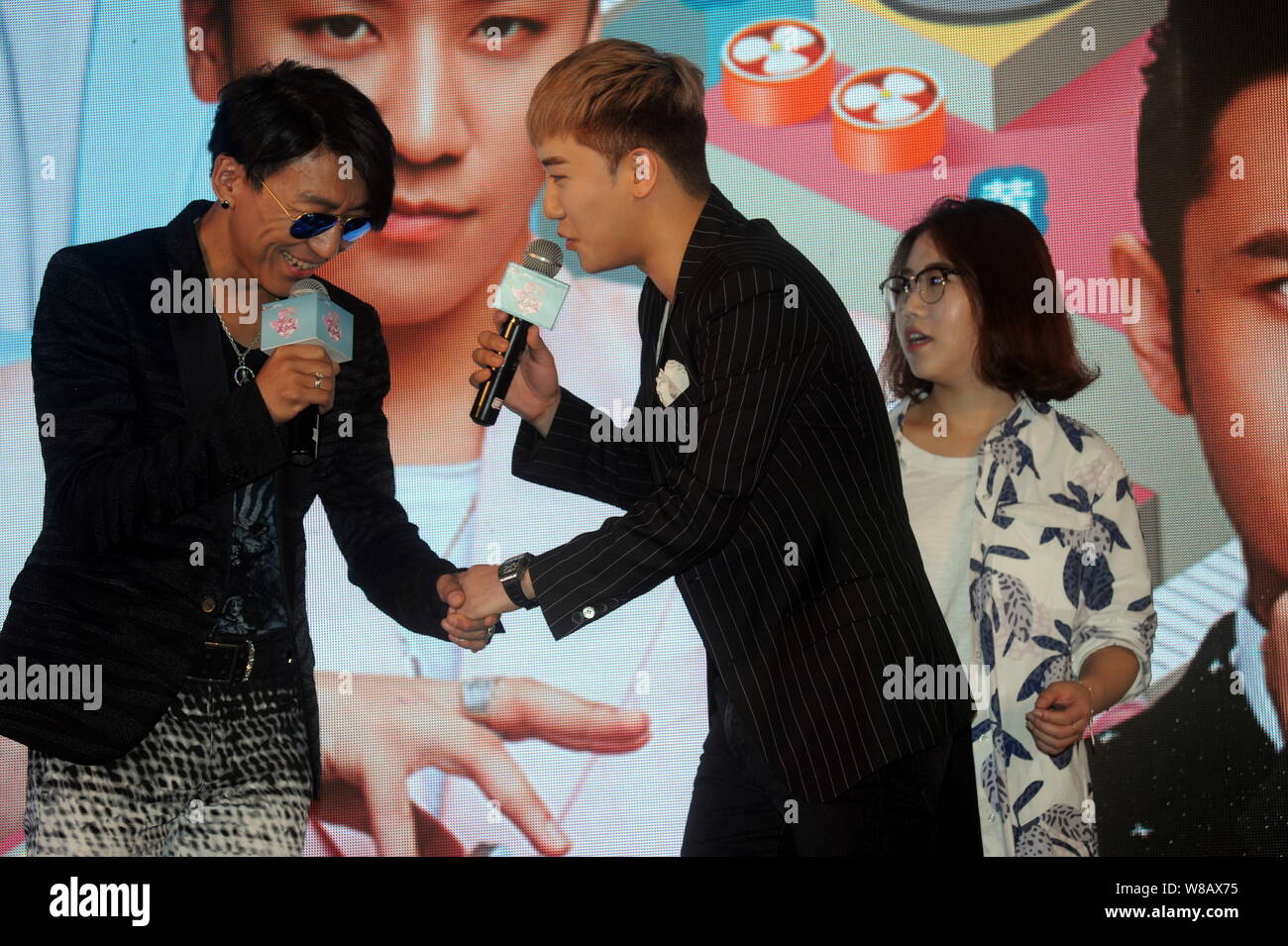 Singer and actor Lee Seung-hyun, center, better known by his stage name ...