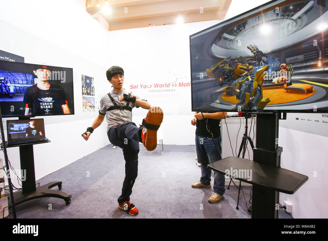 An exhibitor demonstrates a motion capture device during an exhibition ...