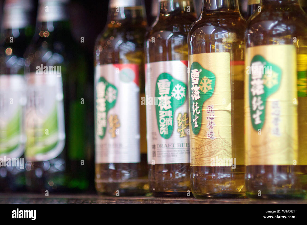 --FILE--Bottles of Snow beer are for sale at a supermarket in Guangzhou ...