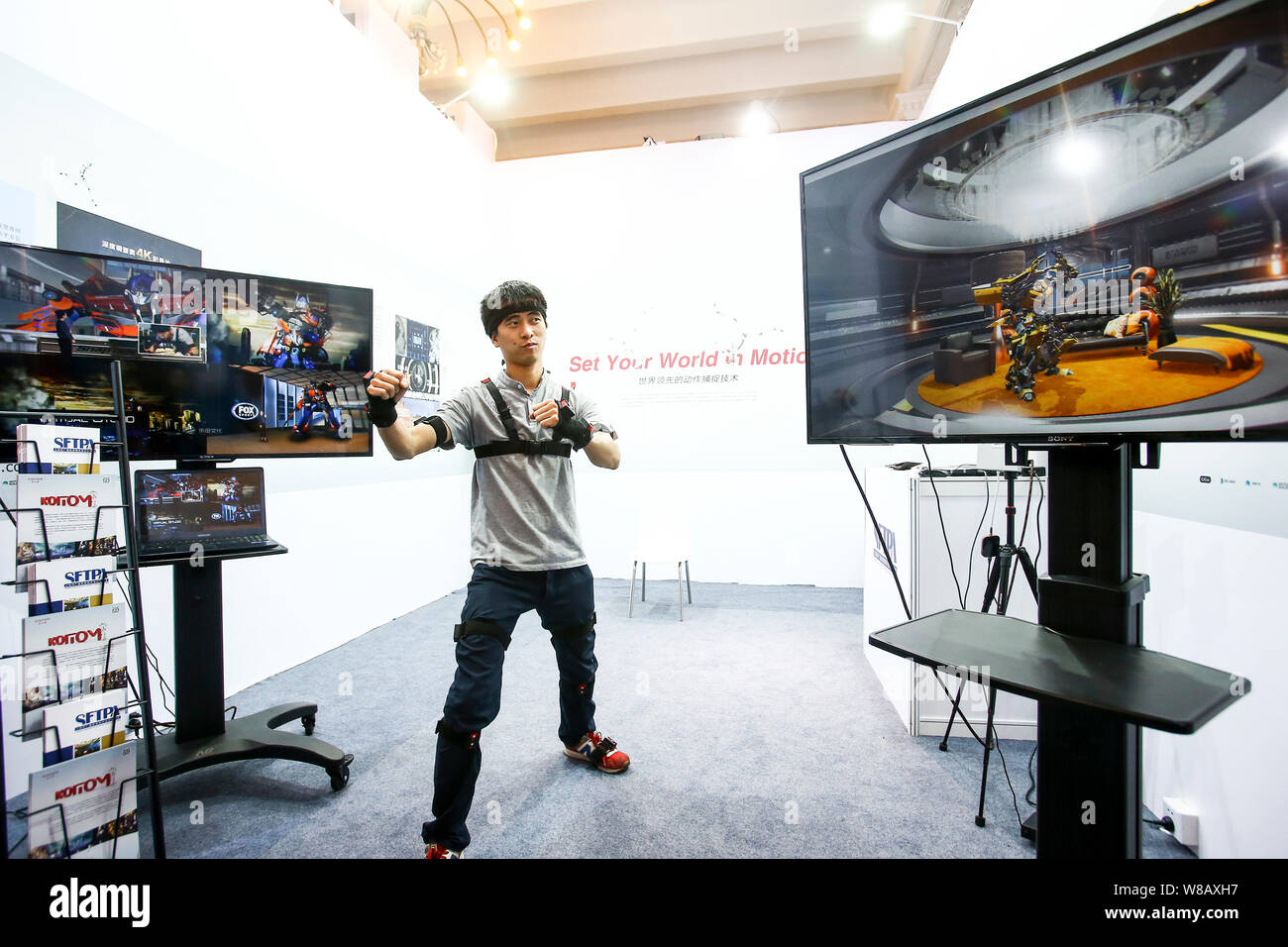 An exhibitor demonstrates a motion capture device during an exhibition ...