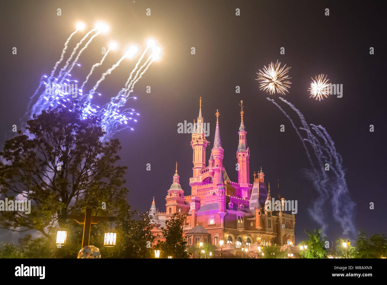 Fireworks explode over the Disney Castle in the Shanghai Disneyland ...