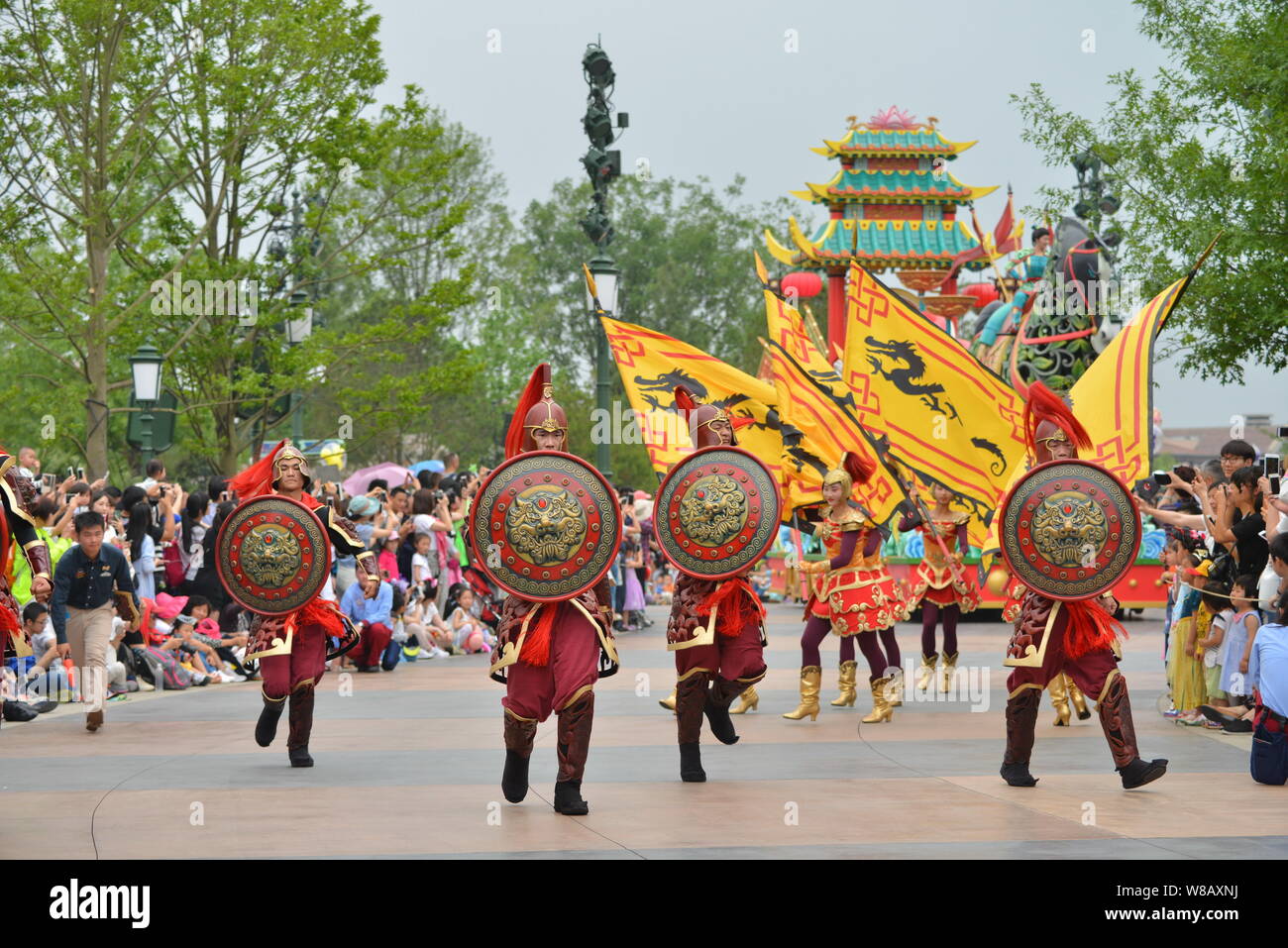 Entertainers perform during a parade in the Shanghai Disneyland during ...