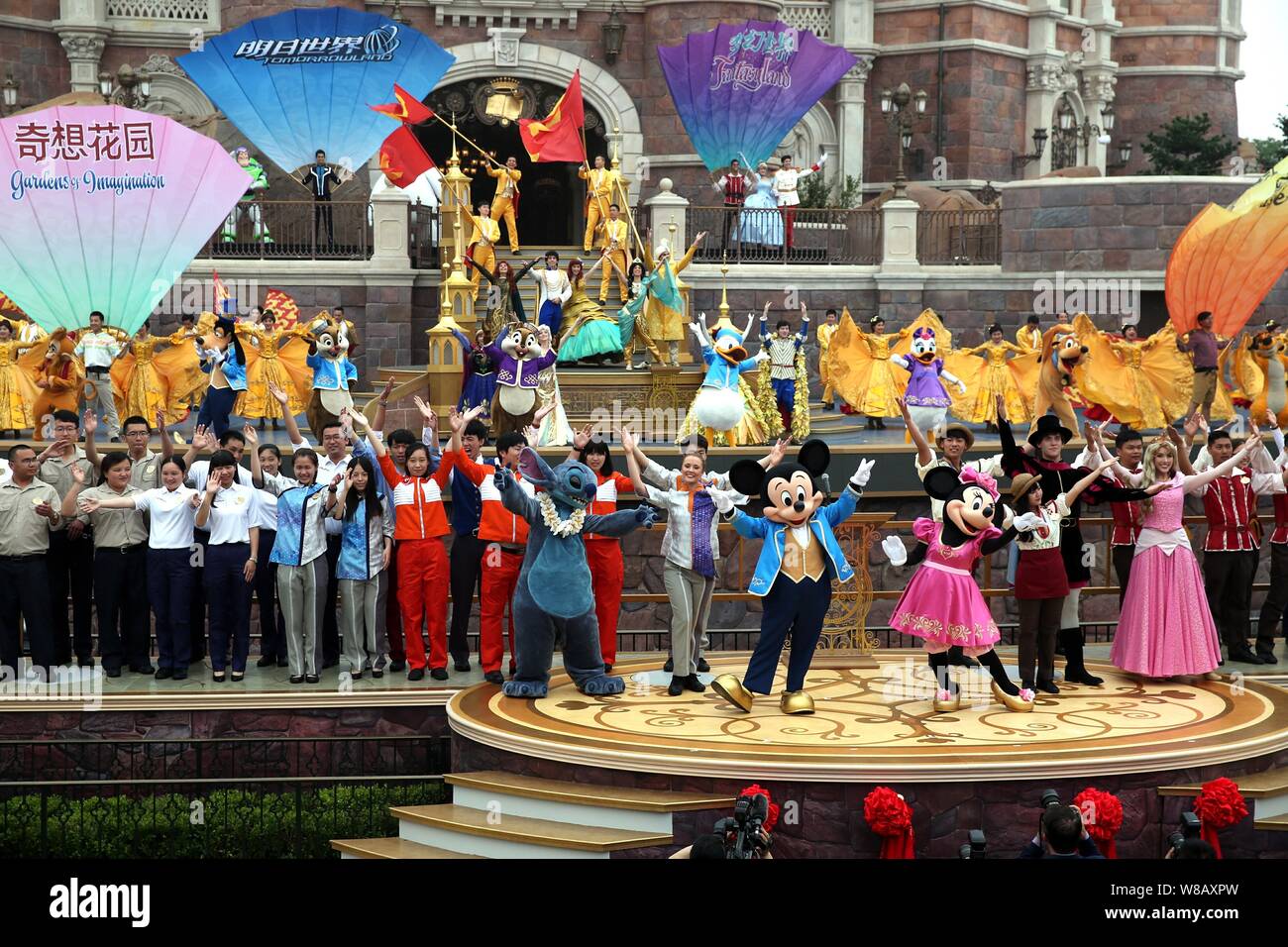 Entertainers perform in front of the Disney Castle during the opening ...