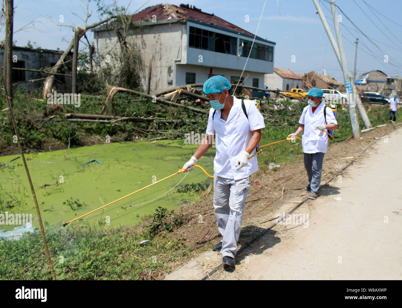 Chinese medical workers disinfect Zhiqiao village devastated by the ...
