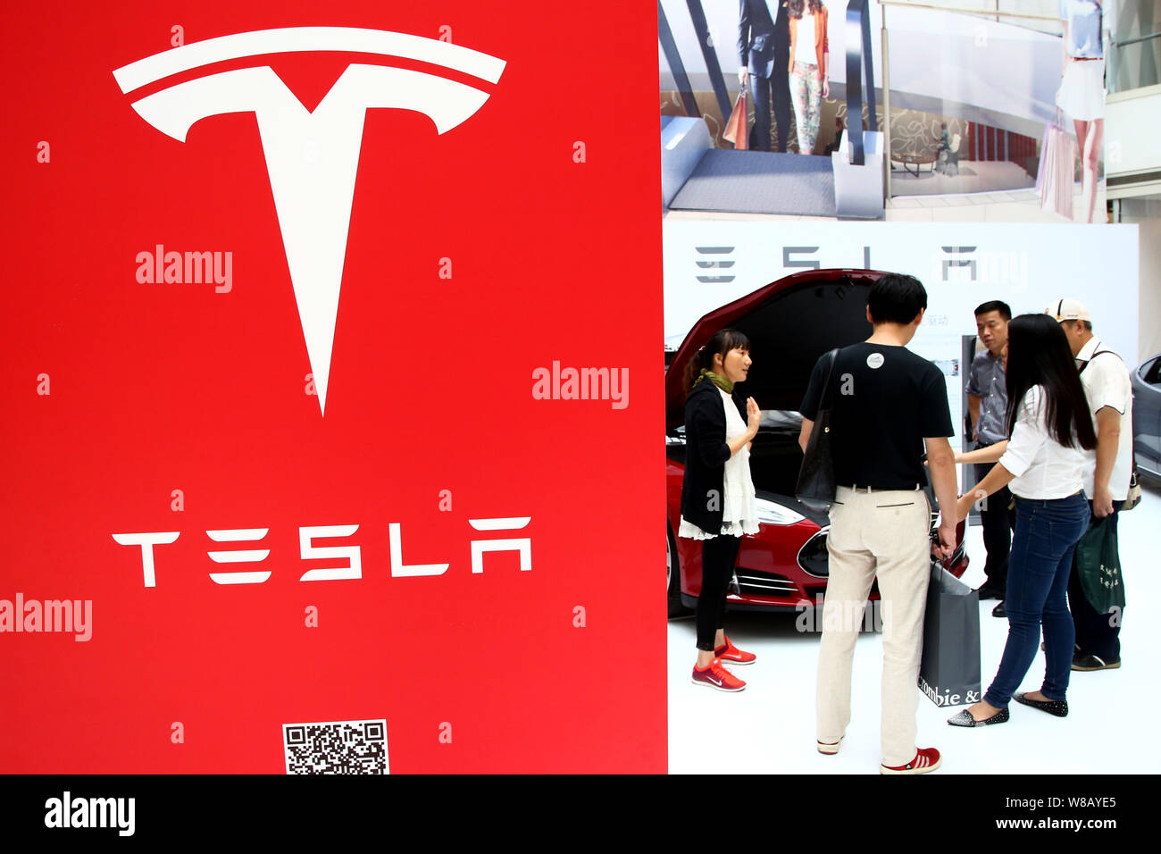 --FILE--People visit the stand of Tesla during an exhibition in ...