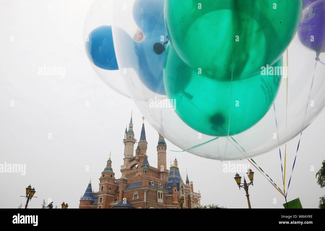 Mickey Mouse balloons are pictured near the Disney Castle in the ...