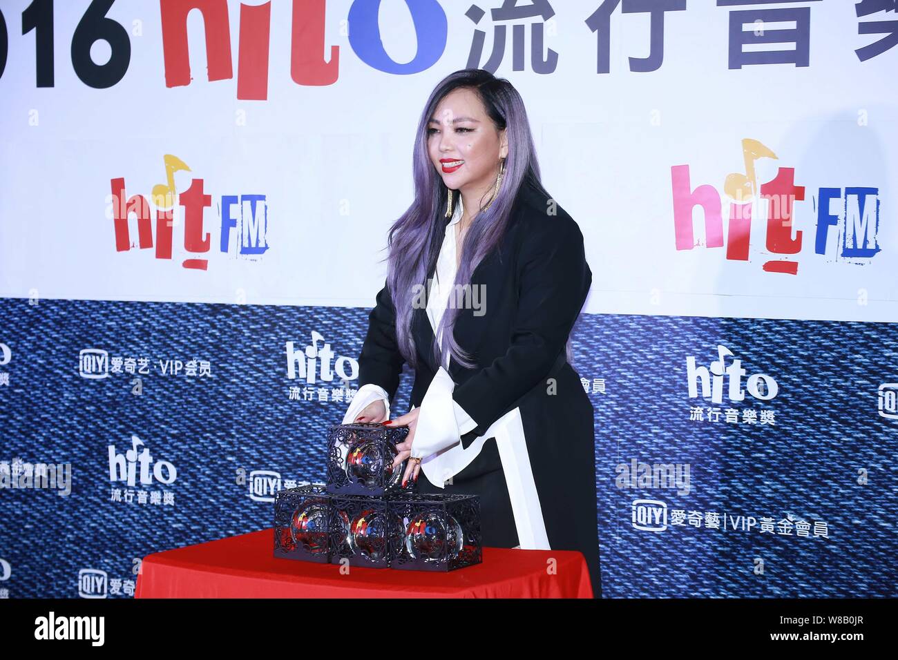 Taiwanese singer A-Mei or Chang Hui-mei poses with her trophies at the ...