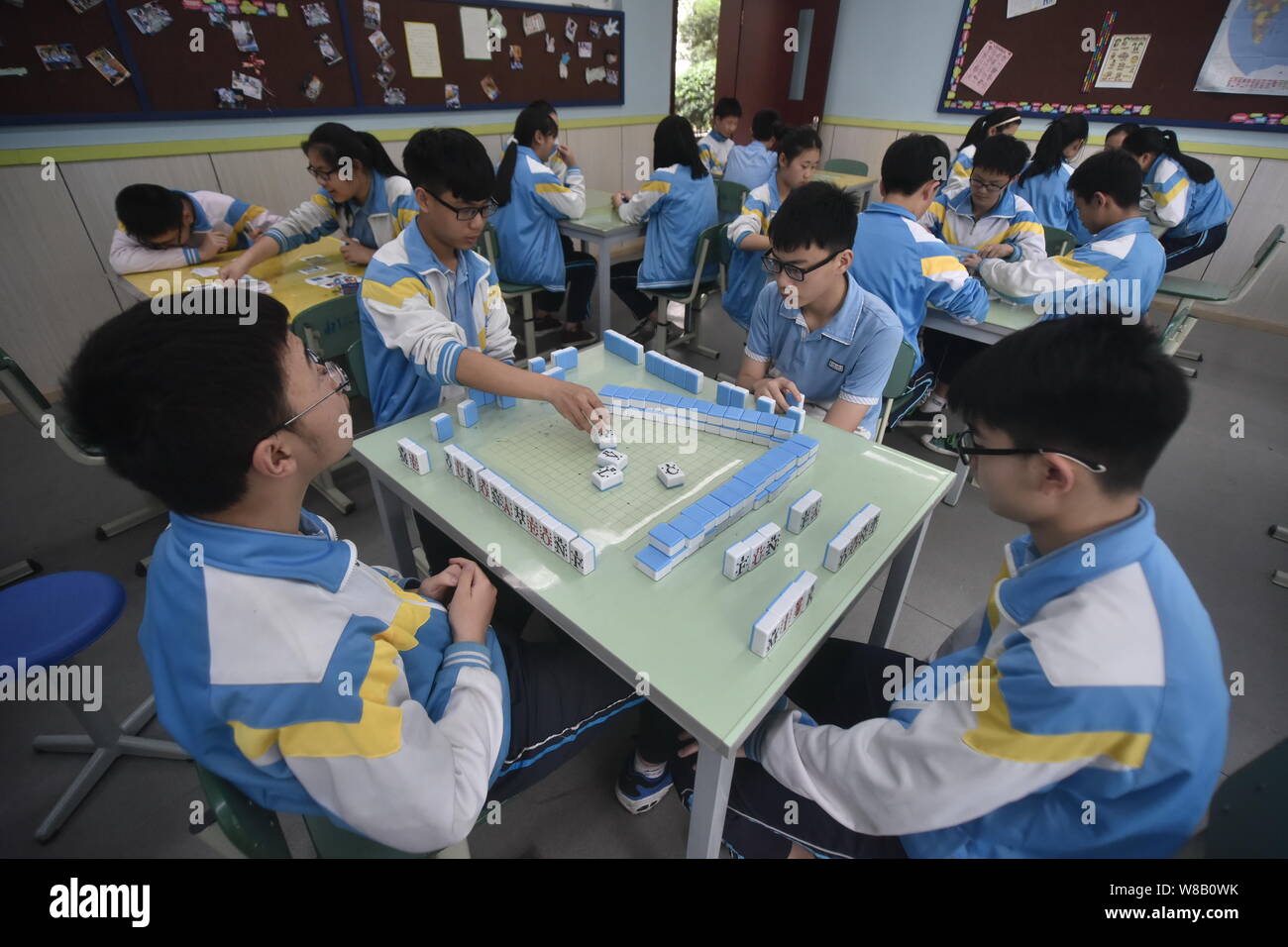 Young Chinese student play "English Mahjong" to learn English in the ...