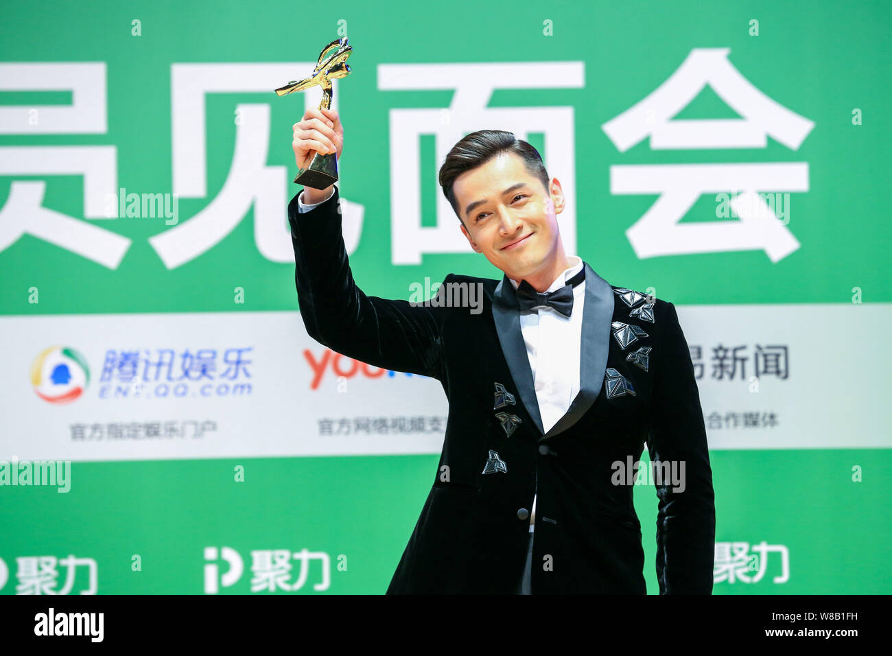 Chinese actor Hu Ge poses with his trophy for the Best Actor award for ...