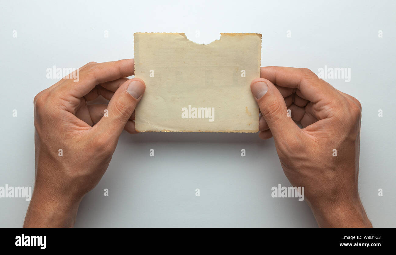Old photo in the hands of man. Empty template for picture, mock-up ...